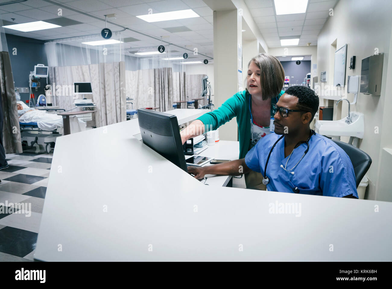 Doctor and nurse using computer Stock Photo - Alamy