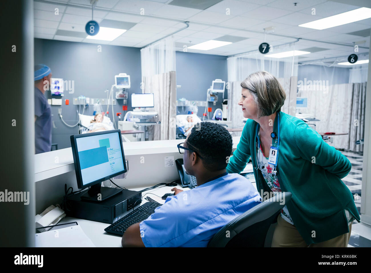 Doctor and nurse using computer Stock Photo - Alamy