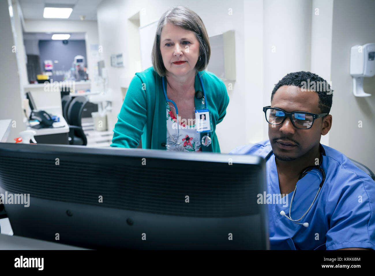 Doctor and nurse using computer Stock Photo - Alamy