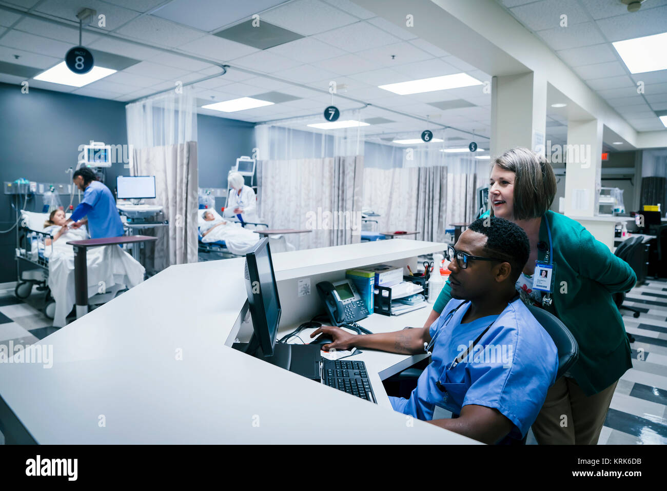 Doctor and nurse using computer in hospital Stock Photo - Alamy