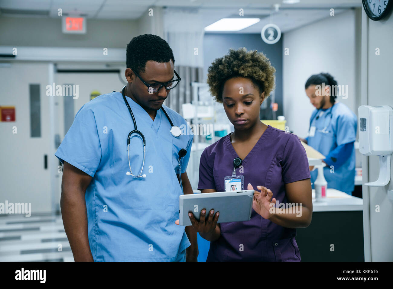 Nurse is using digital tablet in hospital Stock Photo - Alamy