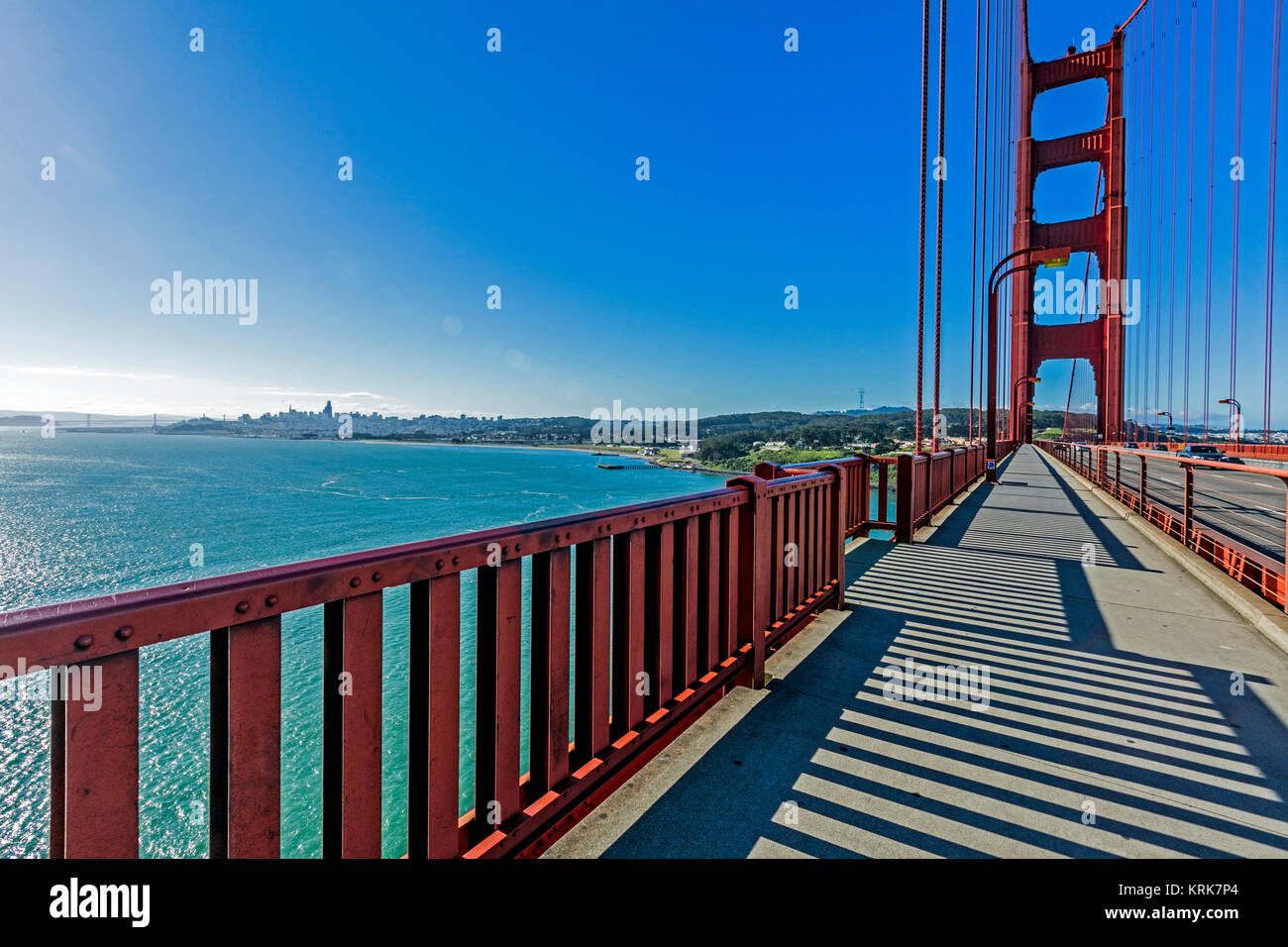 Shadows on walkway of bridge Stock Photo - Alamy
