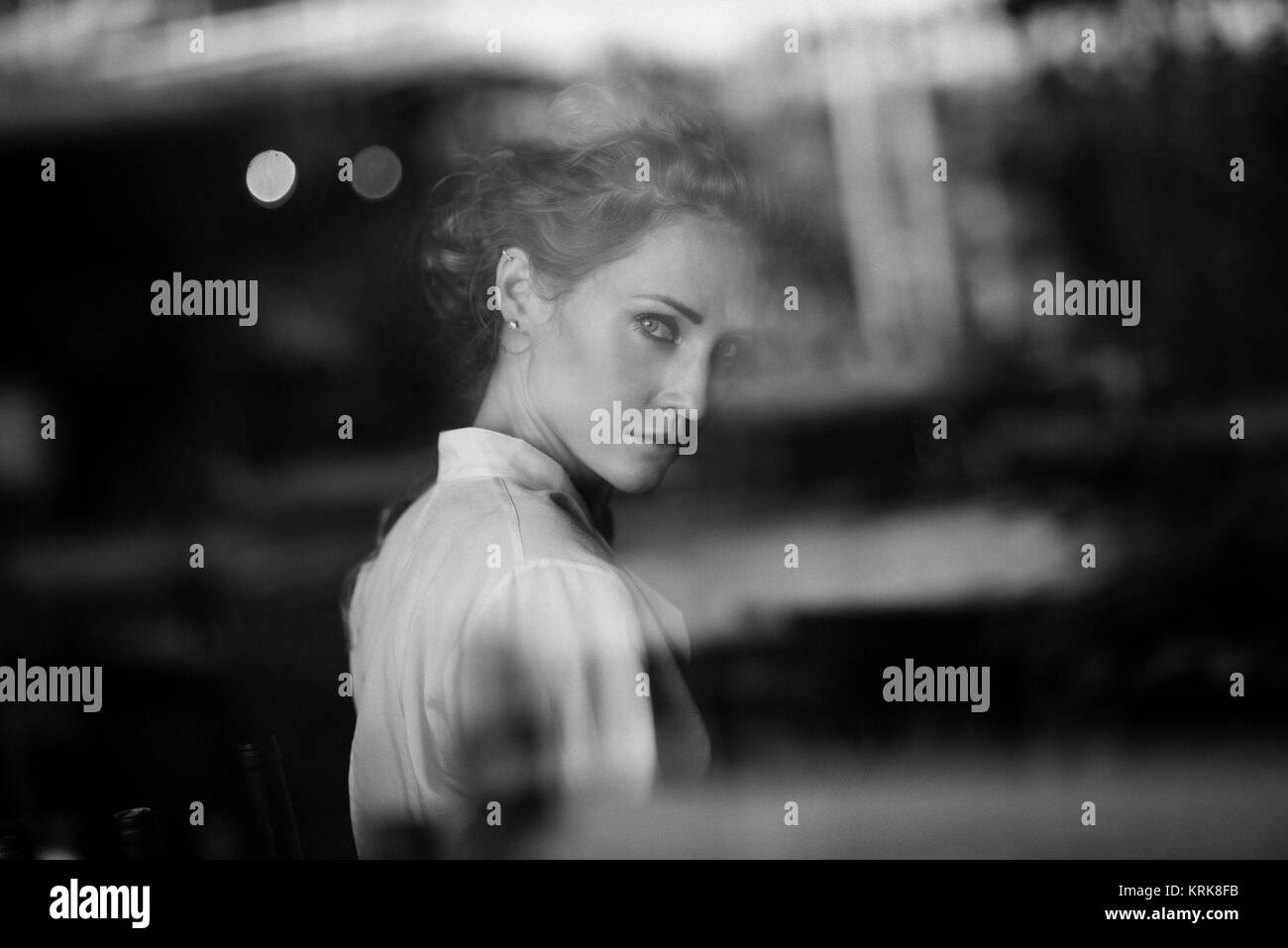 Portrait of serious Caucasian woman behind window Stock Photo - Alamy