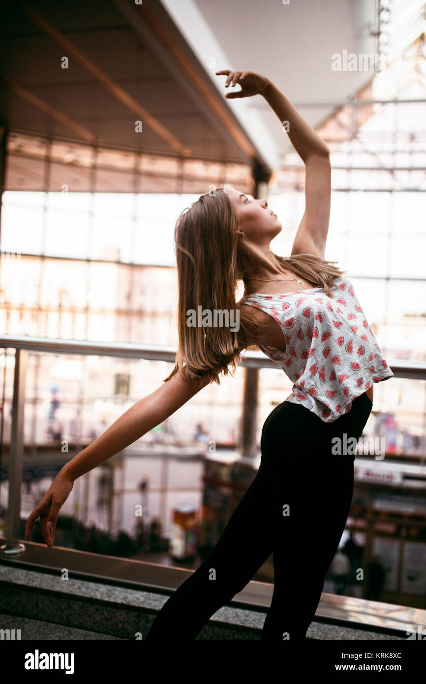 Caucasian woman dancing near railing Stock Photo - Alamy