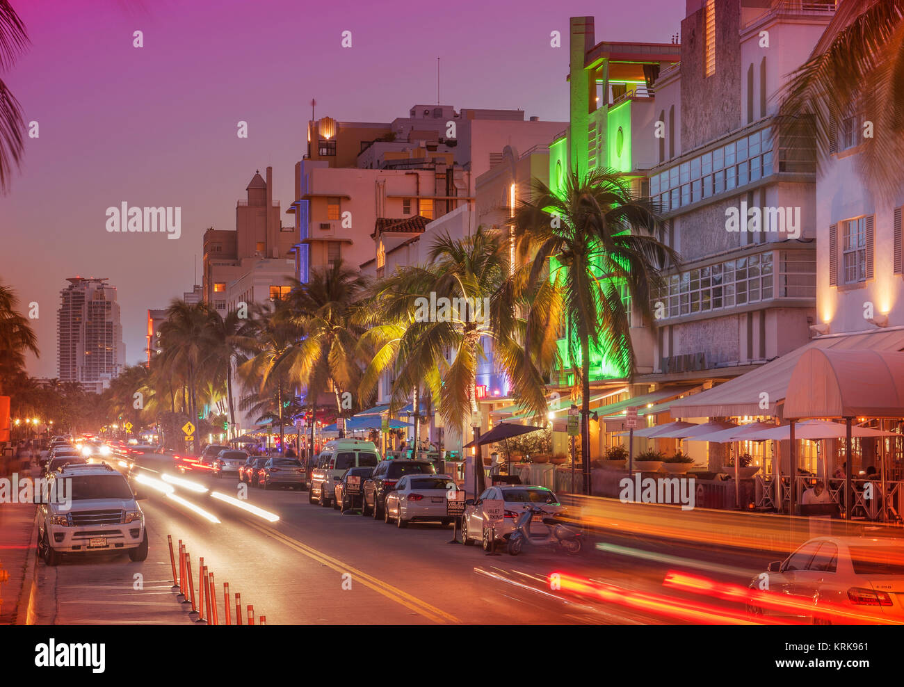 Cars driving in street at night, Miami Beach, Florida, United States ...