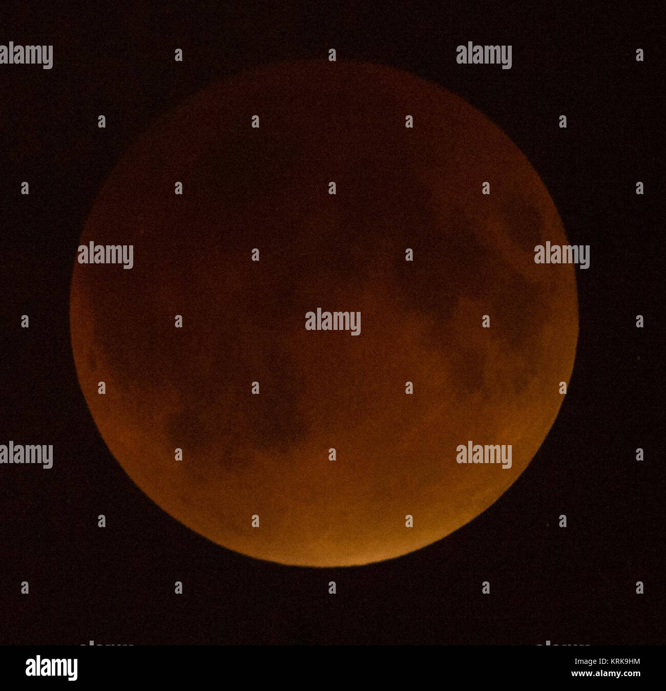 A perigee full moon, or supermoon, is seen during a total lunar eclipse ...