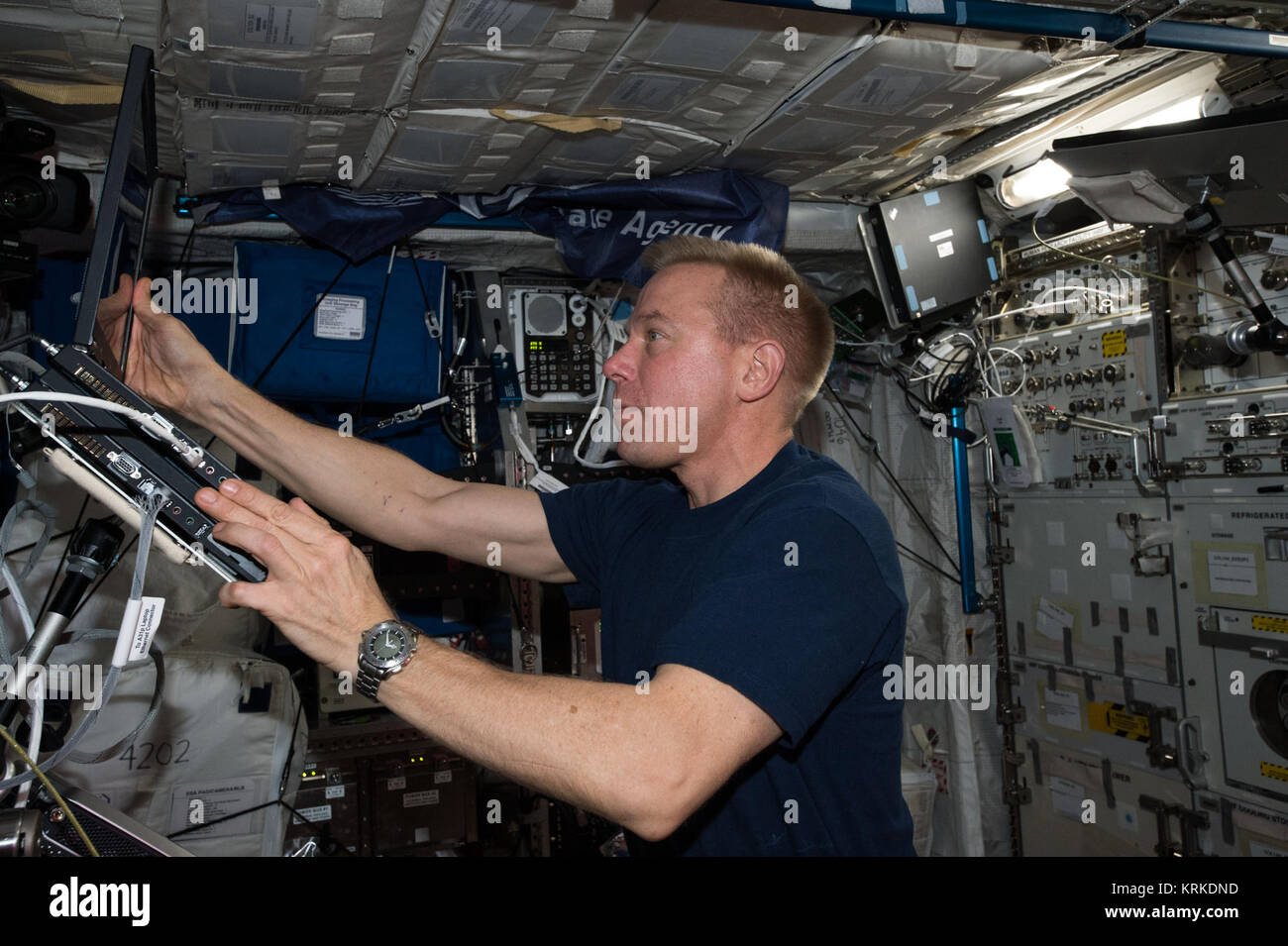 ISS-46 Tim Kopra at the Human Research Facility in the Columbus module ...