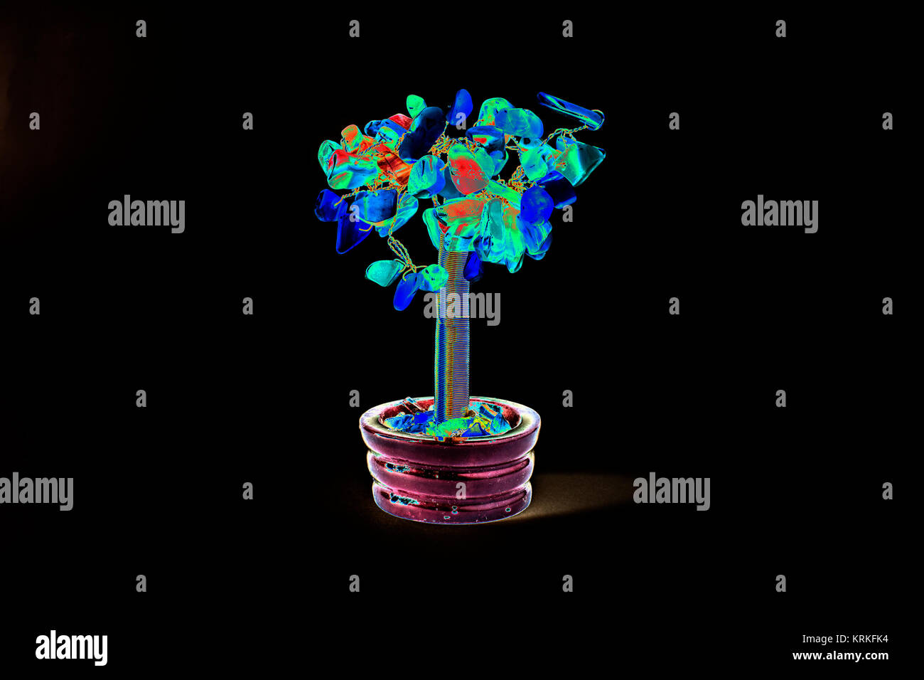 Money tree on a dark background. The tree is blue, blue Stock Photo - Alamy