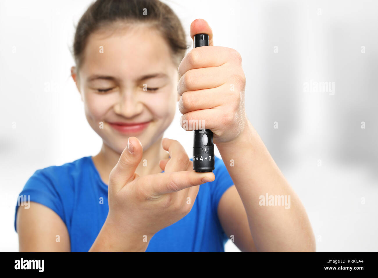 diabetic girl measuring sugar level with a glucometer Stock Photo - Alamy