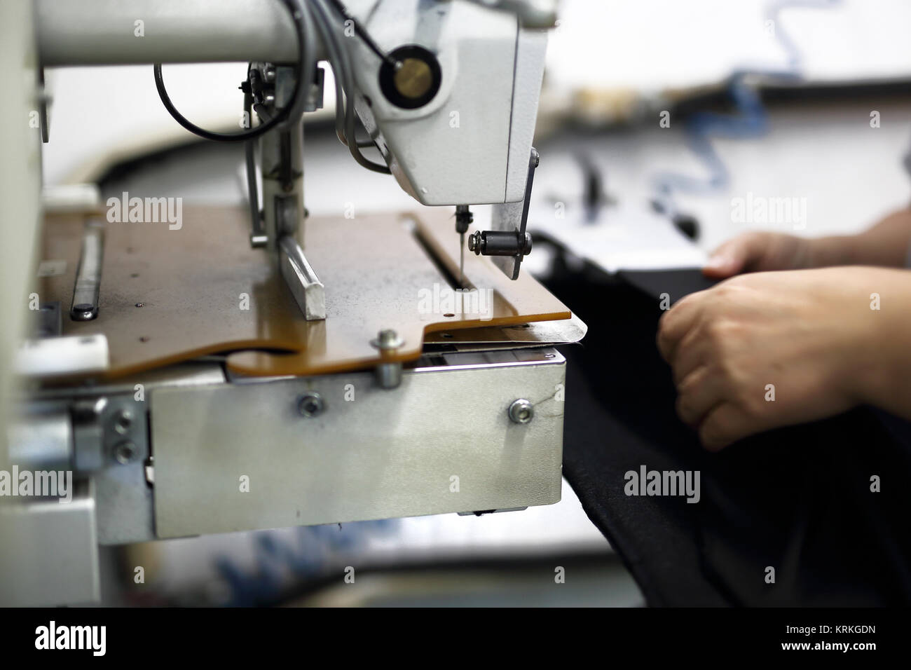 production of clothes,sewing on a machine Stock Photo - Alamy