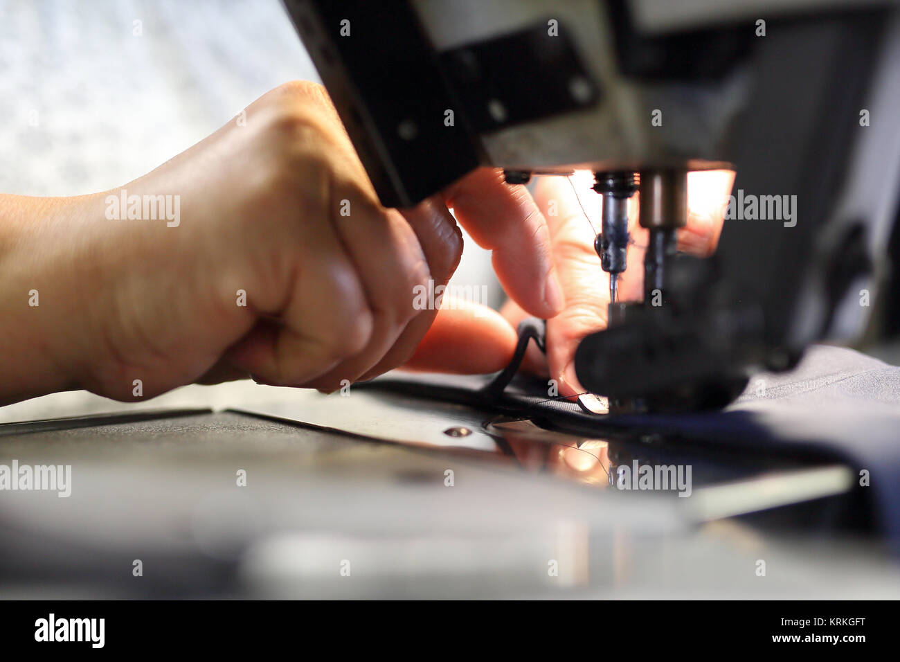 production of clothing,sewing machine overlock Stock Photo - Alamy