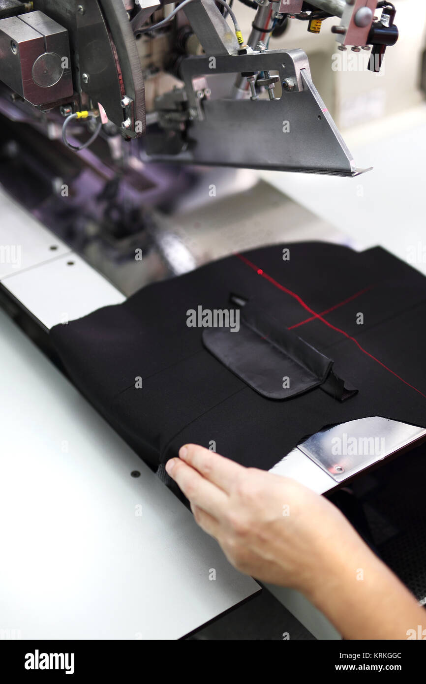 the production plant,sewing clothes by seamstresses on the sewing ...