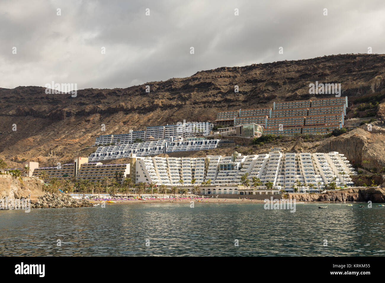 Taurito, Gran Canaria. Beach and hotels seen from the sea, overcast ...