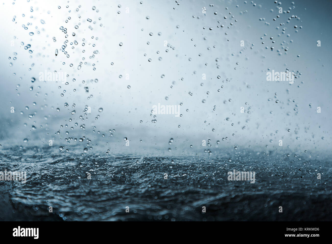 Falling and splashing water drops Stock Photo - Alamy