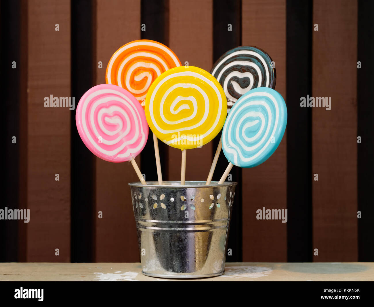 Five lollipops arranged in a metal pot Stock Photo - Alamy