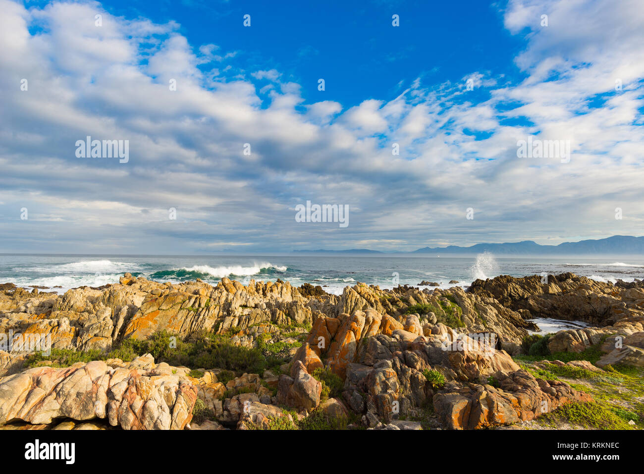 Rocky coast line on the ocean at De Kelders, South Africa, famous for whale watching. Winter ...