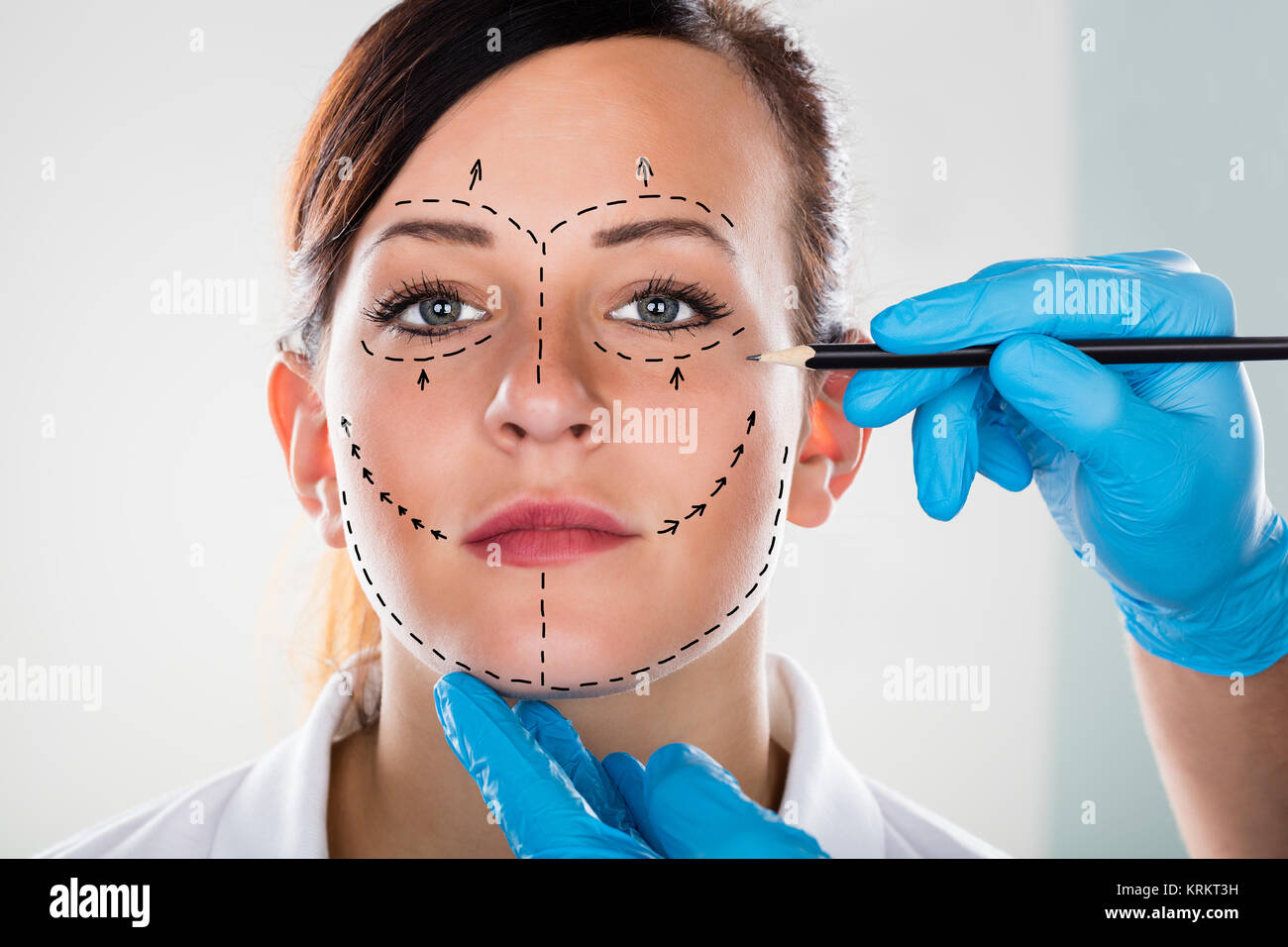 Person's Hand Drawing Correction Line On Woman's Face Stock Photo - Alamy