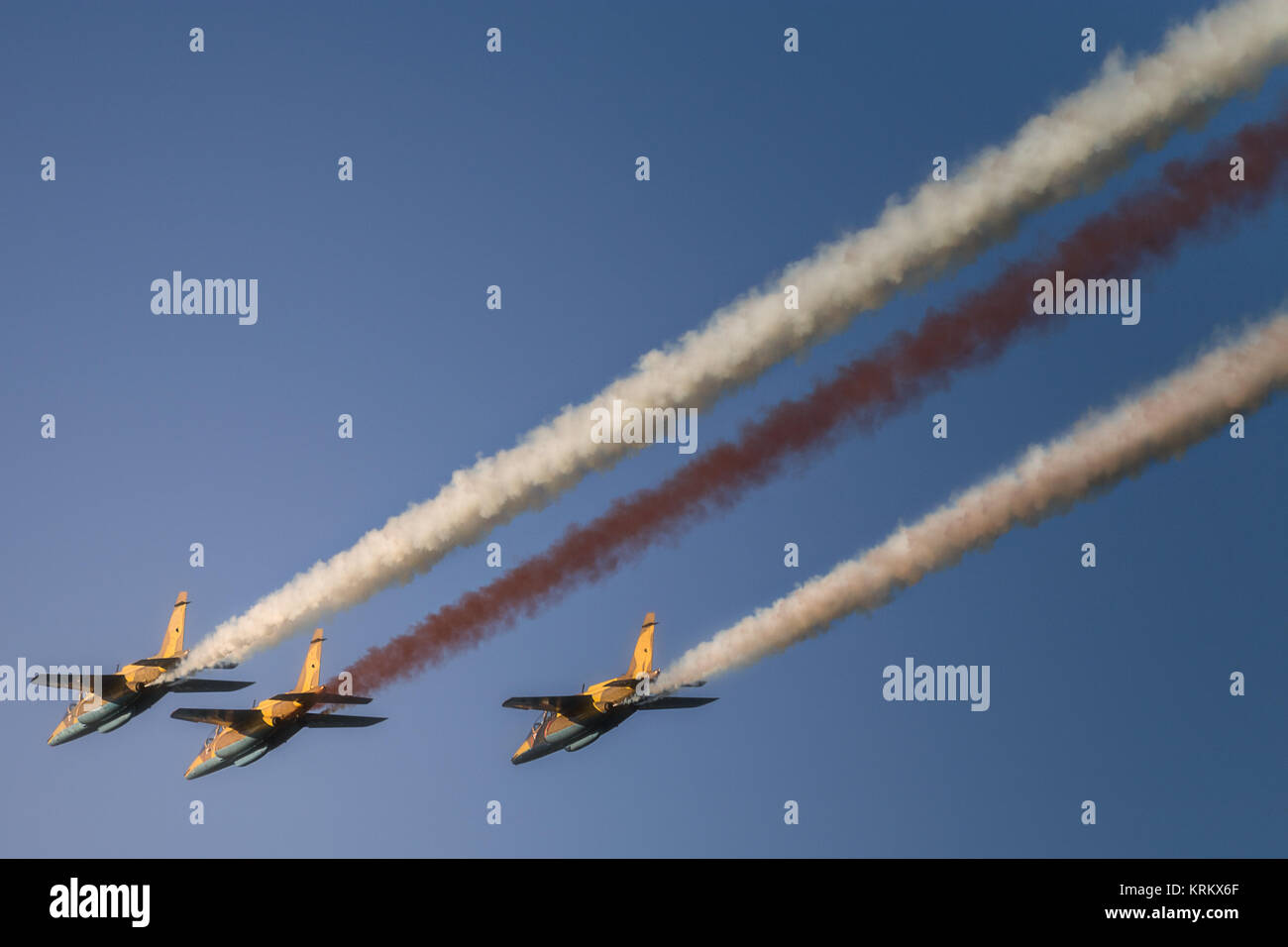 Reactive jet plane flying in formation on blue sky Stock Photo - Alamy