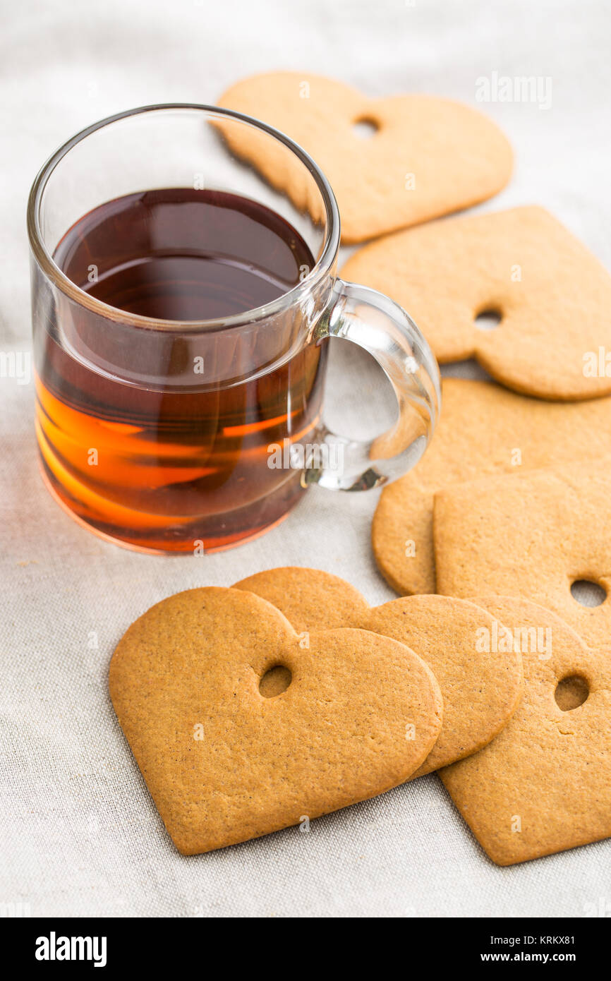 Gingerbread heart shape and cup of tea Stock Photo - Alamy