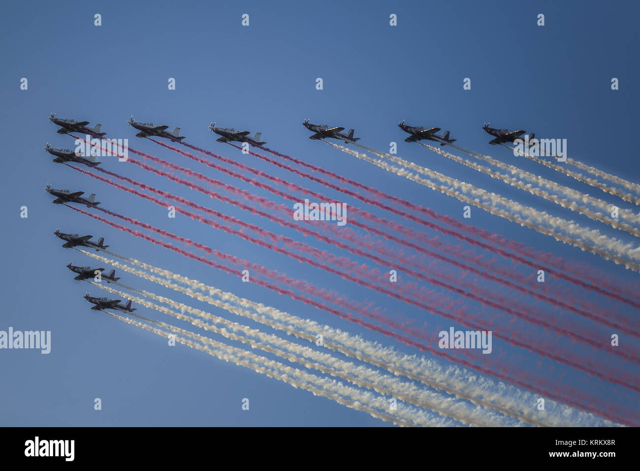 Reactive jet plane flying in formation on blue sky Stock Photo - Alamy