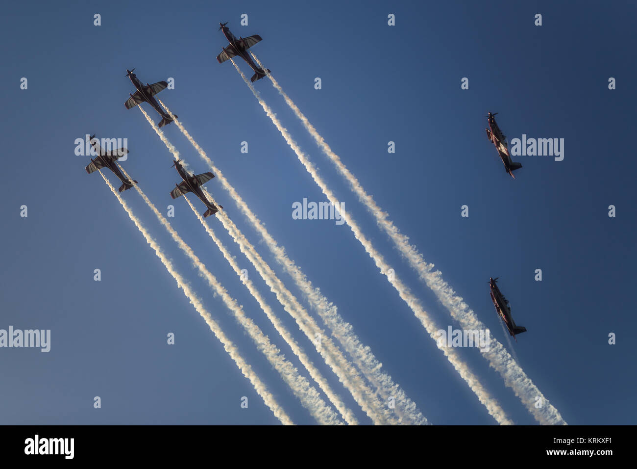 Reactive jet plane flying in formation on blue sky Stock Photo - Alamy