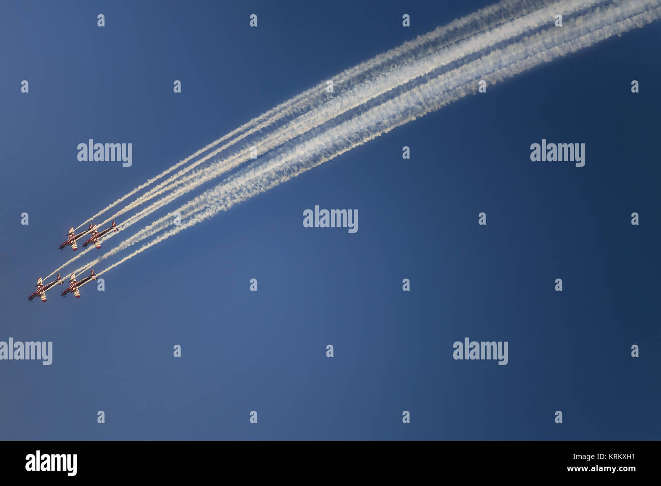 Reactive jet plane flying in formation on blue sky Stock Photo - Alamy