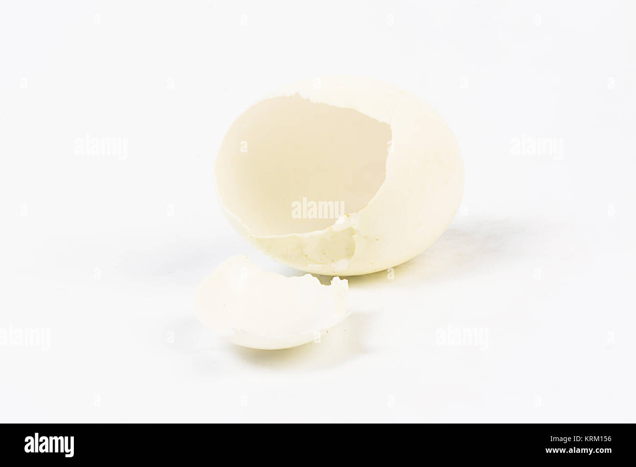 Egg shell on white background Stock Photo - Alamy