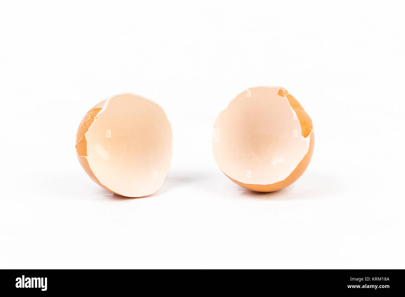 Egg shell on white background Stock Photo - Alamy