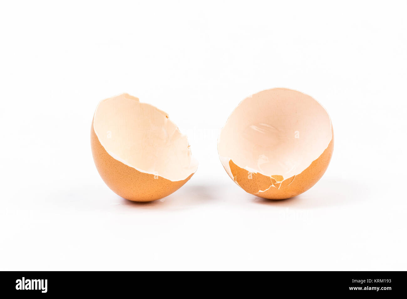 Egg shell on white background Stock Photo - Alamy