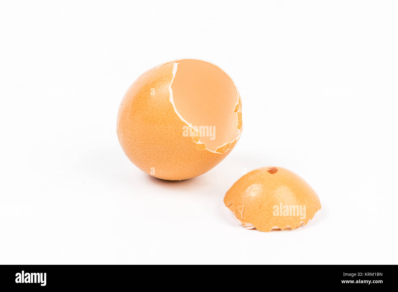 Egg shell on white background Stock Photo - Alamy