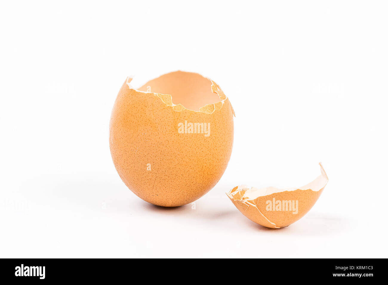 Egg shell on white background Stock Photo - Alamy