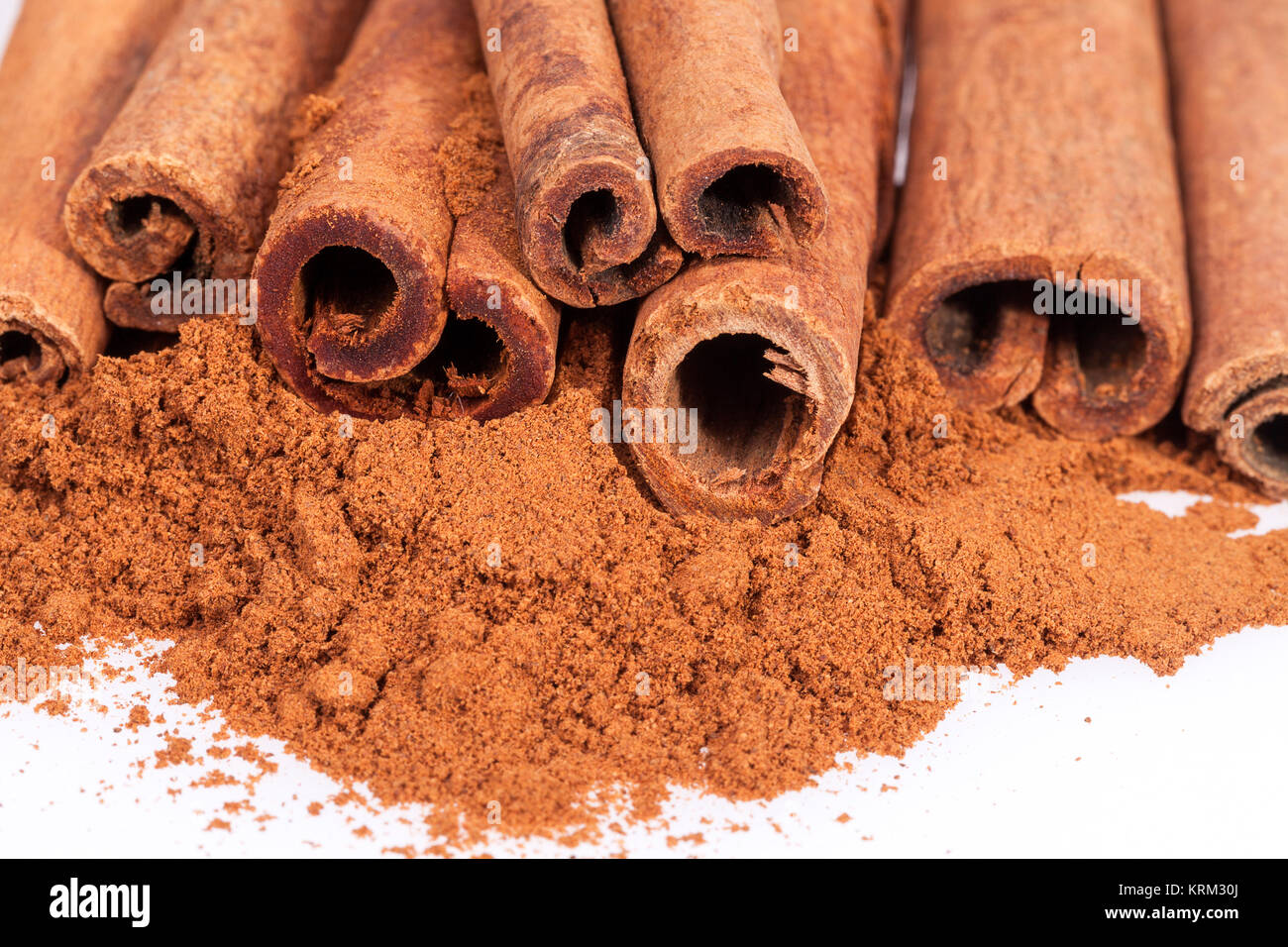 Cinnamon sticks and powder isolated on white background, close up Stock ...