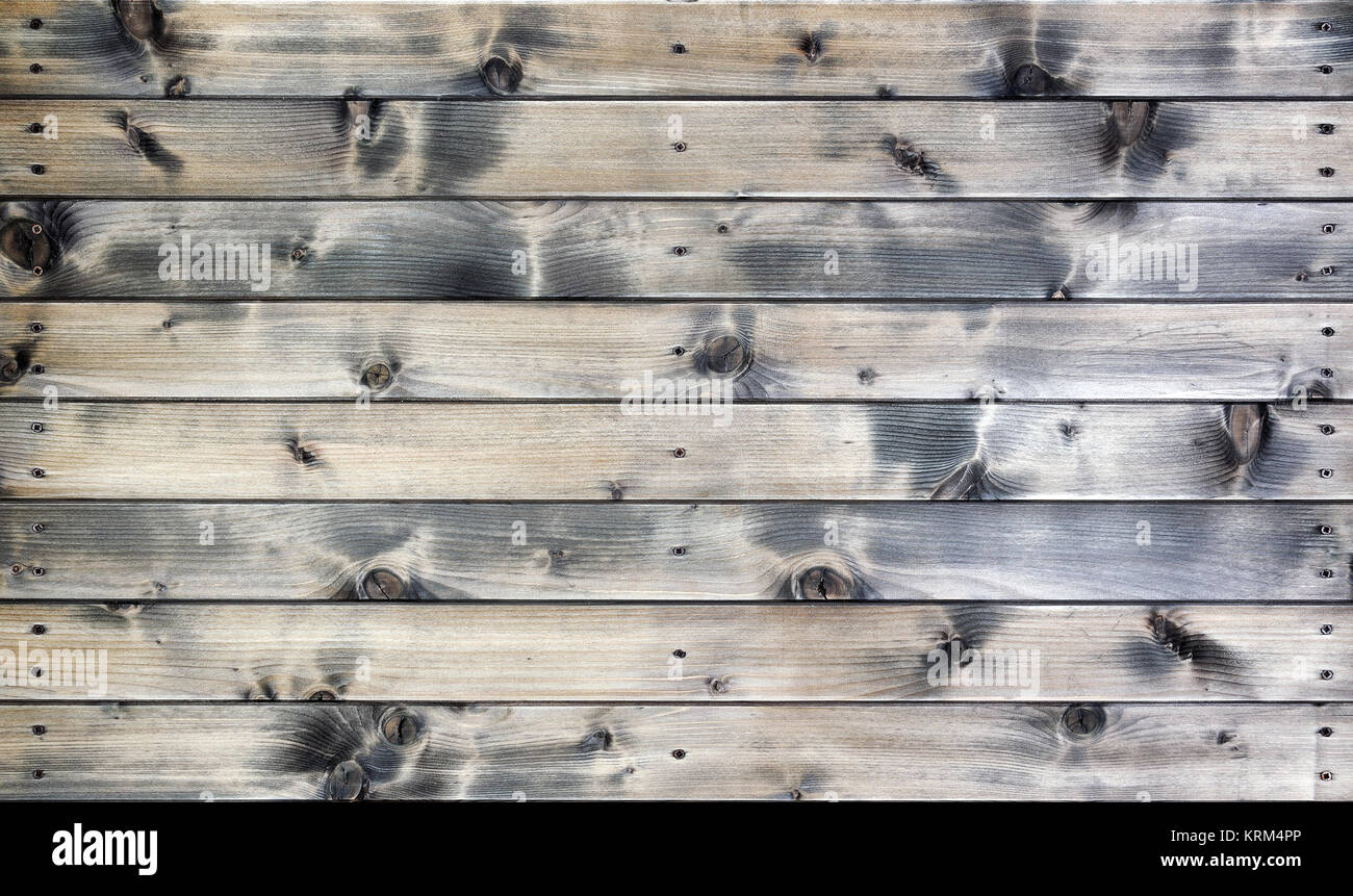 Closeup of a rustic wall built with natural wood planks Stock Photo - Alamy