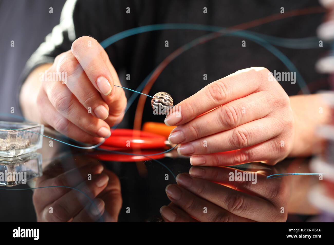 Threading Beads High Resolution Stock Photography and Images - Alamy