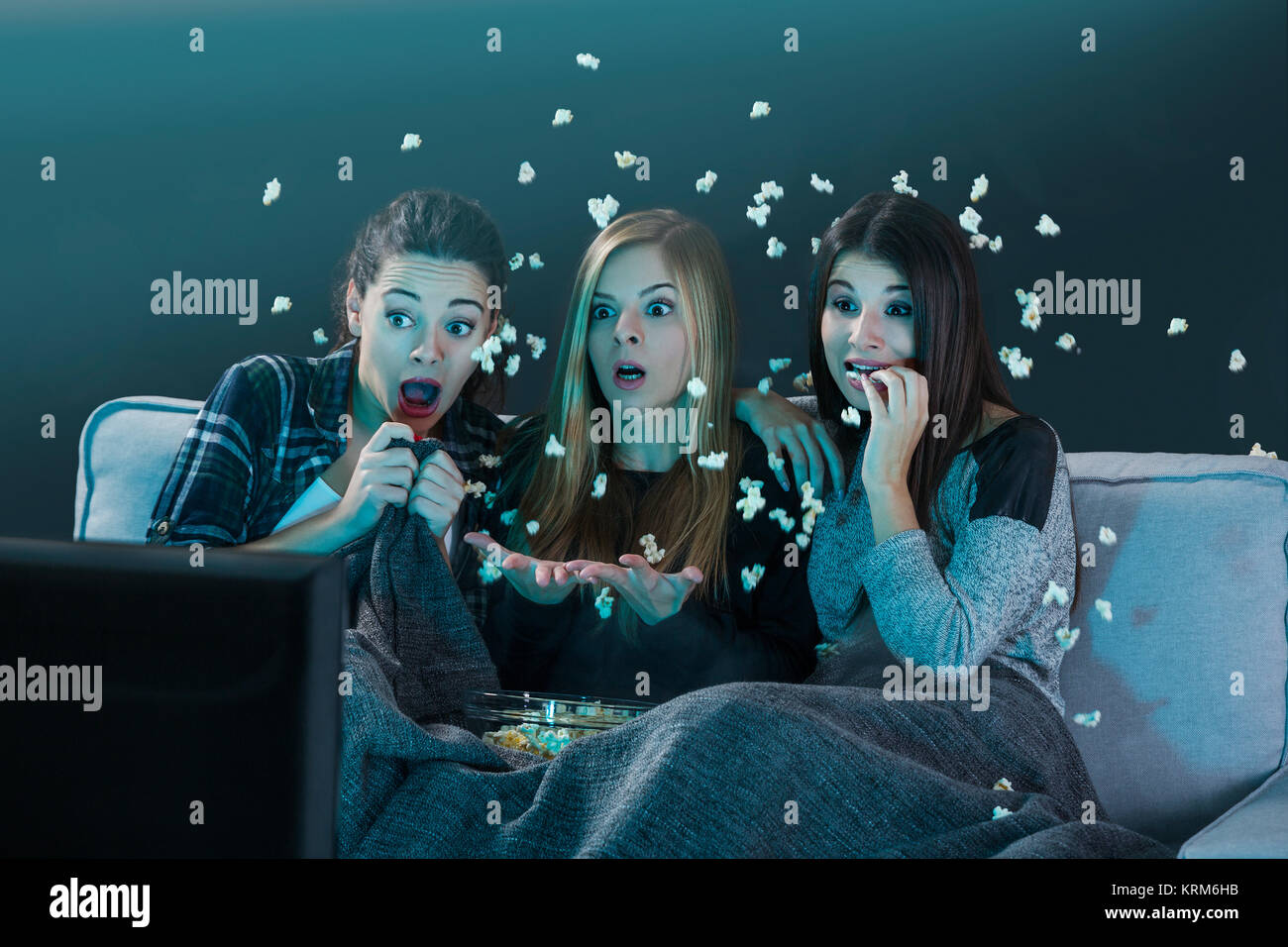 Scared teenage watching movies Stock Photo - Alamy