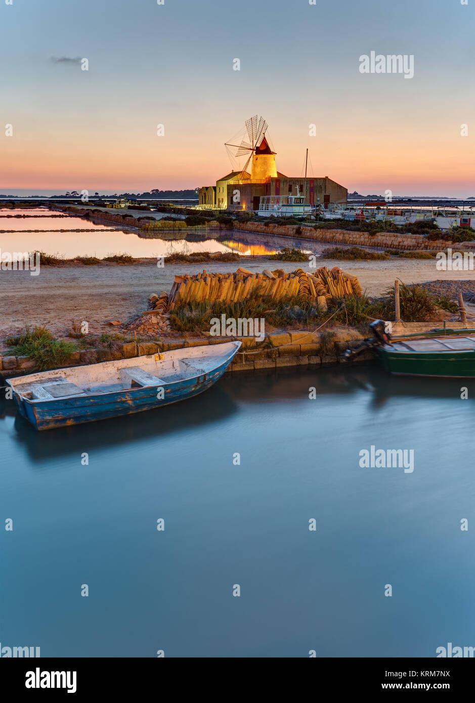 sunset at the salt pans of marsala in sicily Stock Photo - Alamy