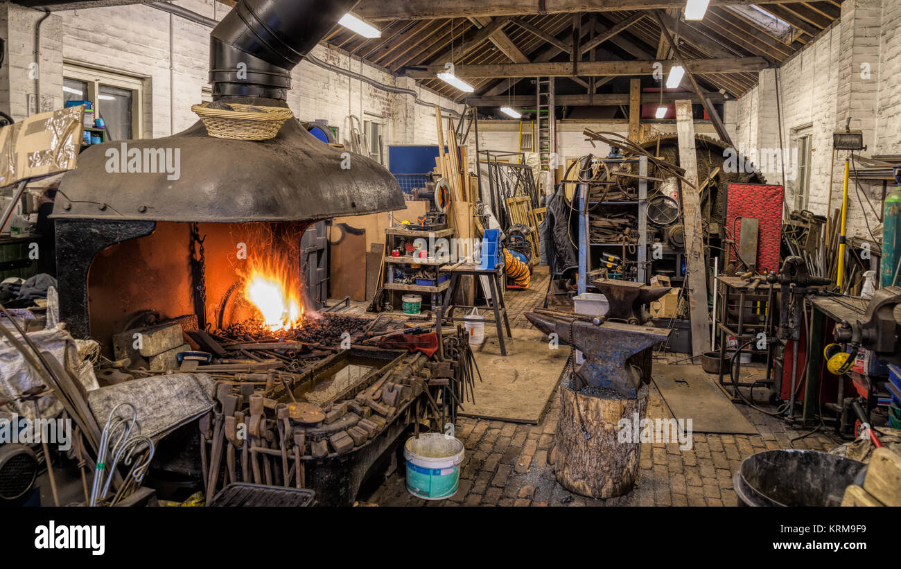 Detailed image of the interior of a building containing a blacksmith ...