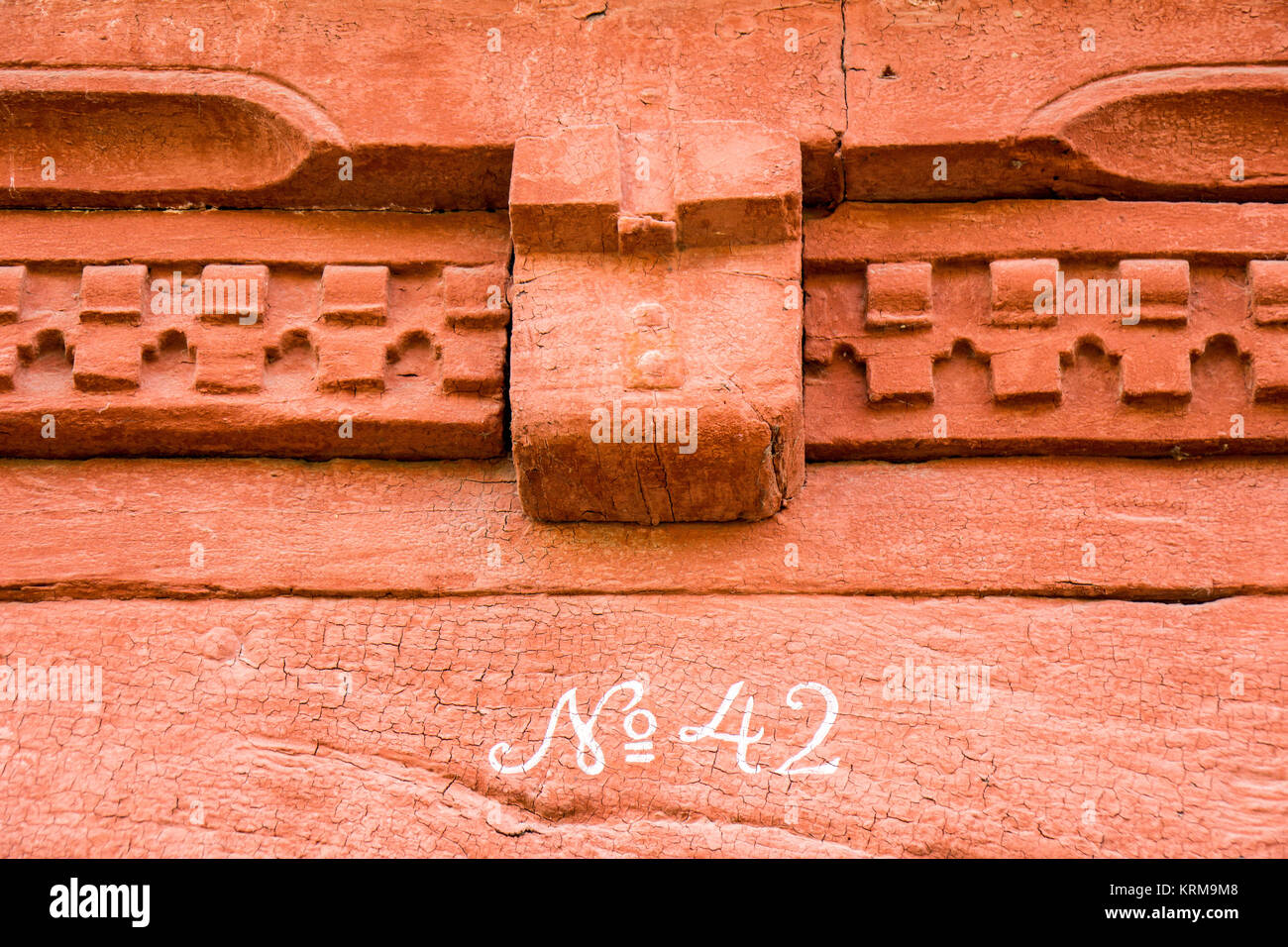 Number 42 on red painted brick wall Stock Photo - Alamy