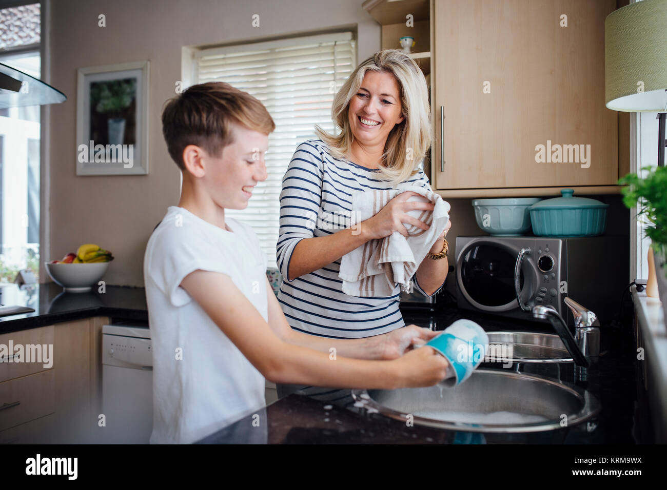 Family doing dishes in hi-res stock photography and images - Alamy