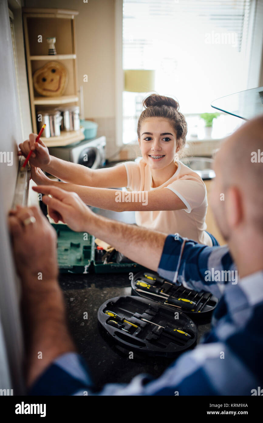 Giving Dad a Hand with DIY Stock Photo - Alamy