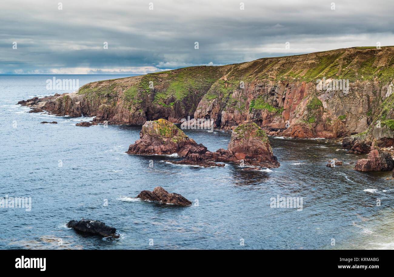 Cliffs, sea stacks, shingle beach and cove at Bloody Foreland, at the ...