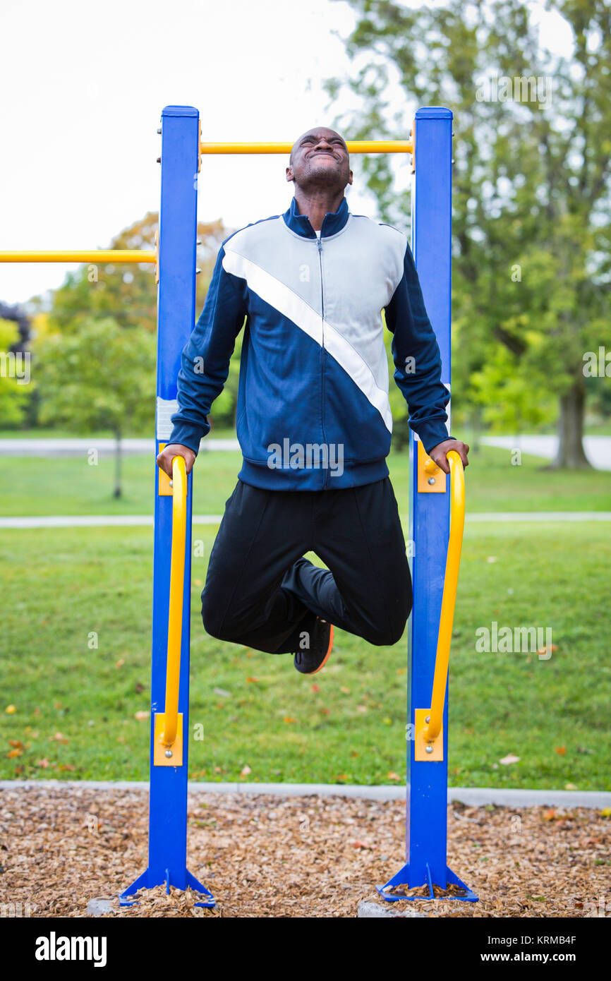 young man working out at outdoor gym Stock Photo - Alamy