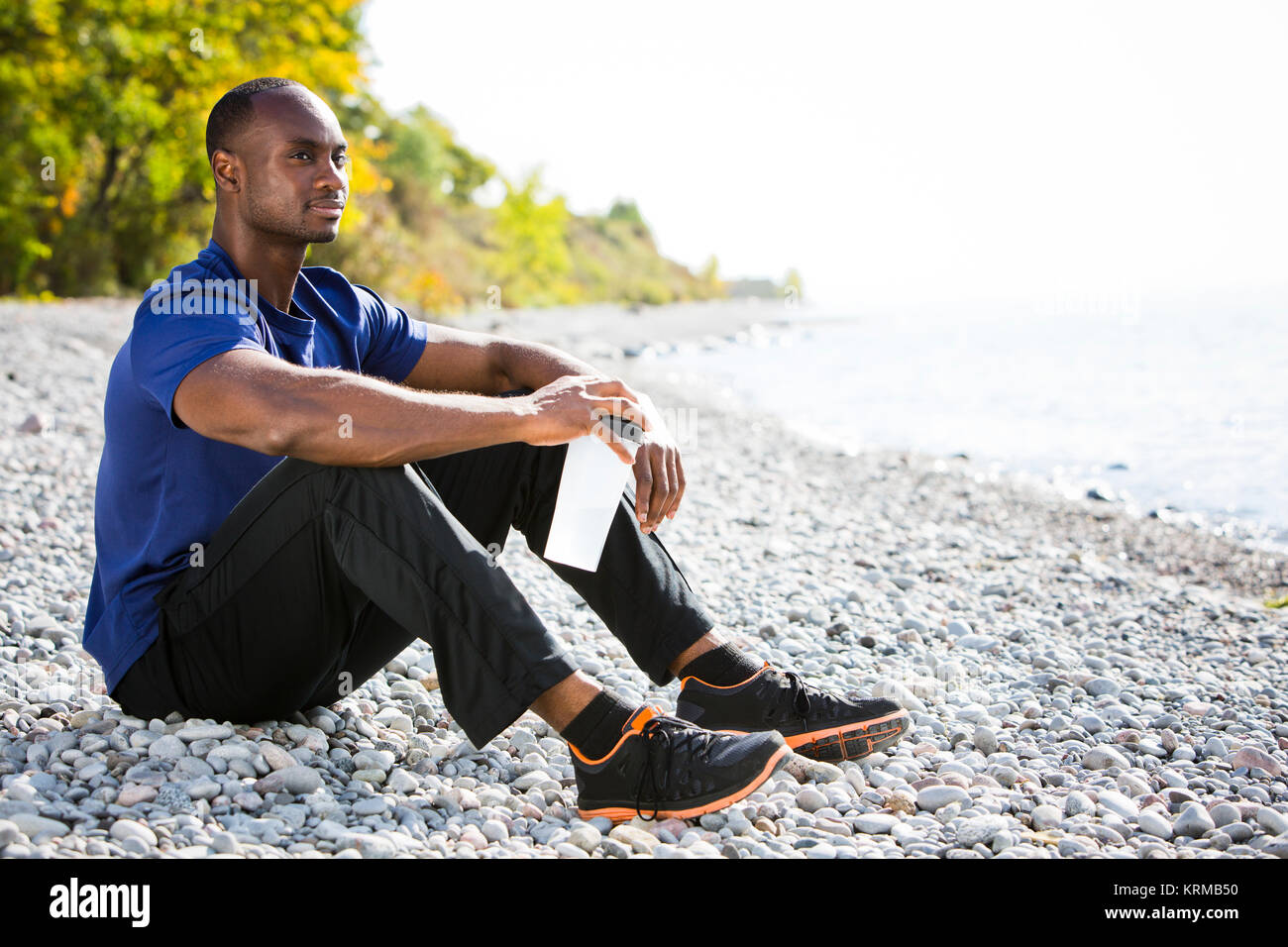 young man relaxing on the beach Stock Photo - Alamy