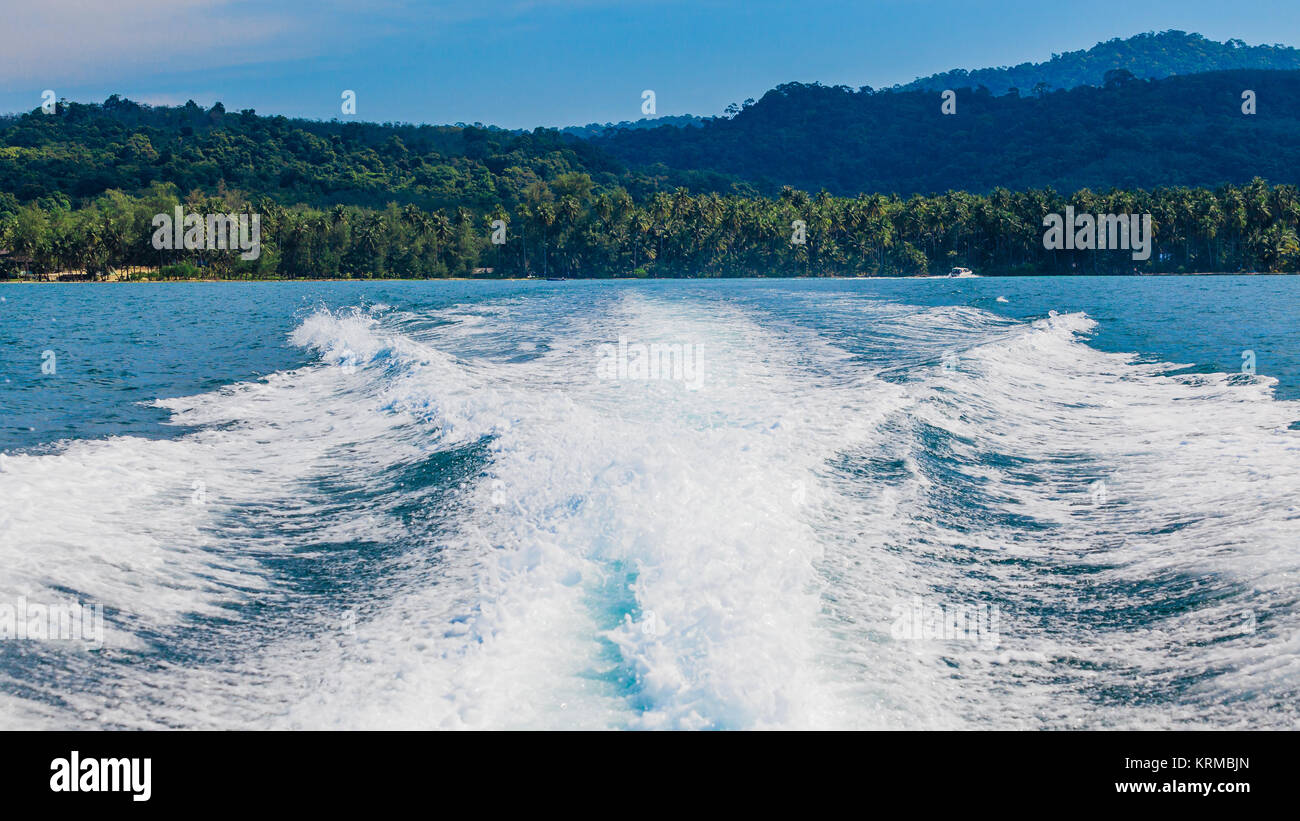 Water stream after speed boat. Trail on water surface behind of fast ...