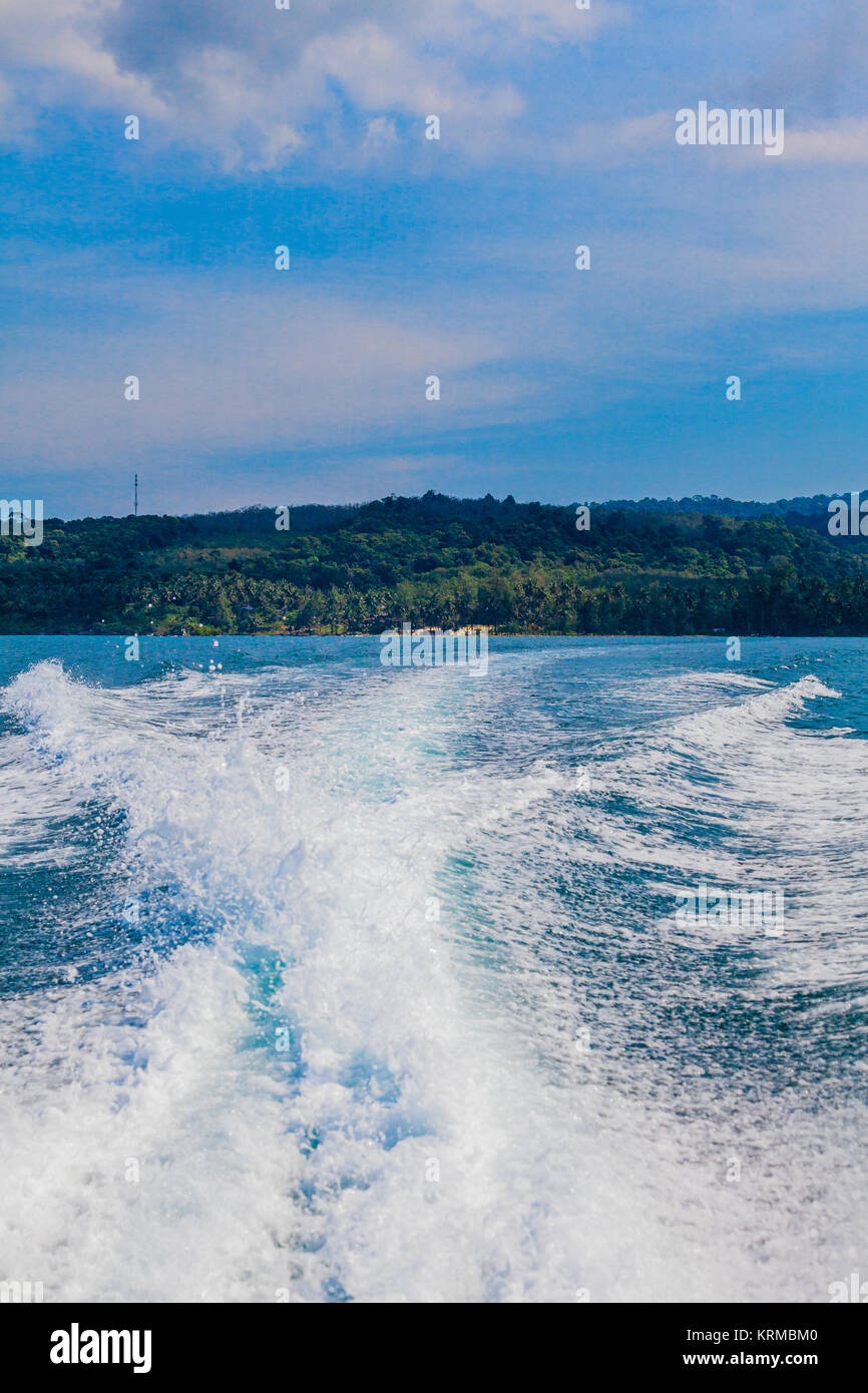Water stream after speed boat. Trail on water surface behind of fast ...