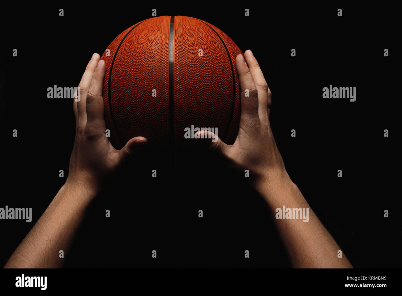Basketball ball in male hands Stock Photo - Alamy