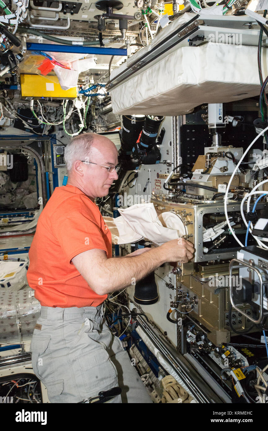 ISS-47 Jeff Williams works with the Light Microscopy Module in the ...