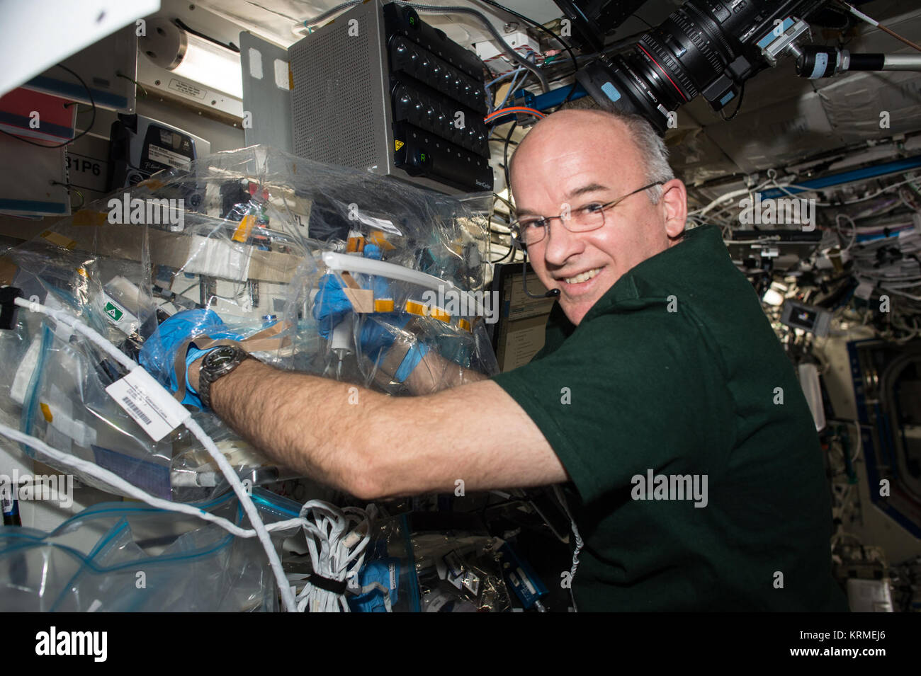 ISS-47 Jeff Williams works with the SmartCycler in the Destiny lab ...