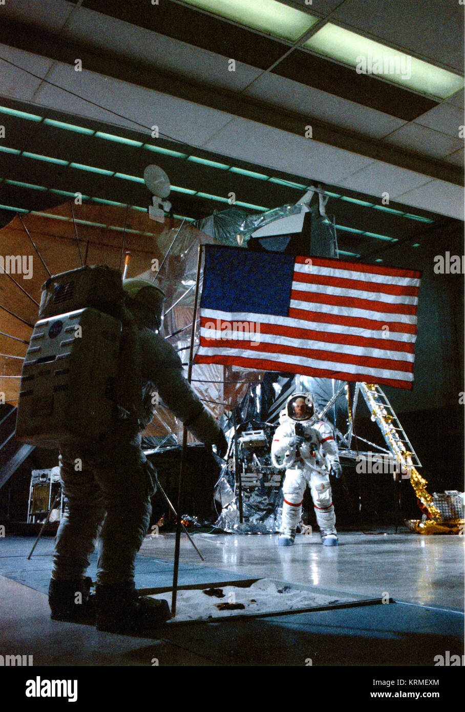 Al Shepard photographs Ed Mitchell and the flag during indoor EVA ...