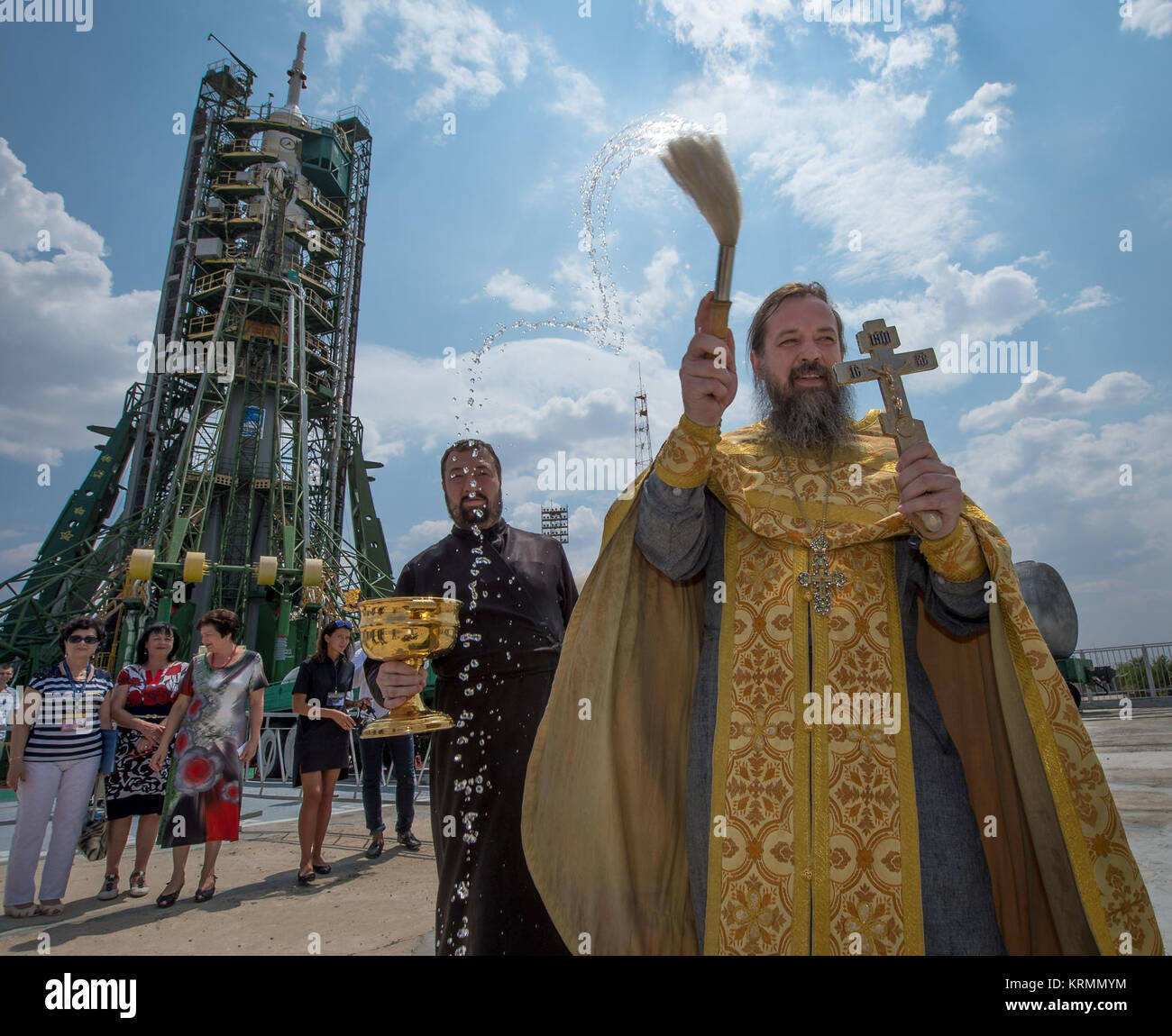 An Orthodox Priest blesses members of the media after he blessed the ...